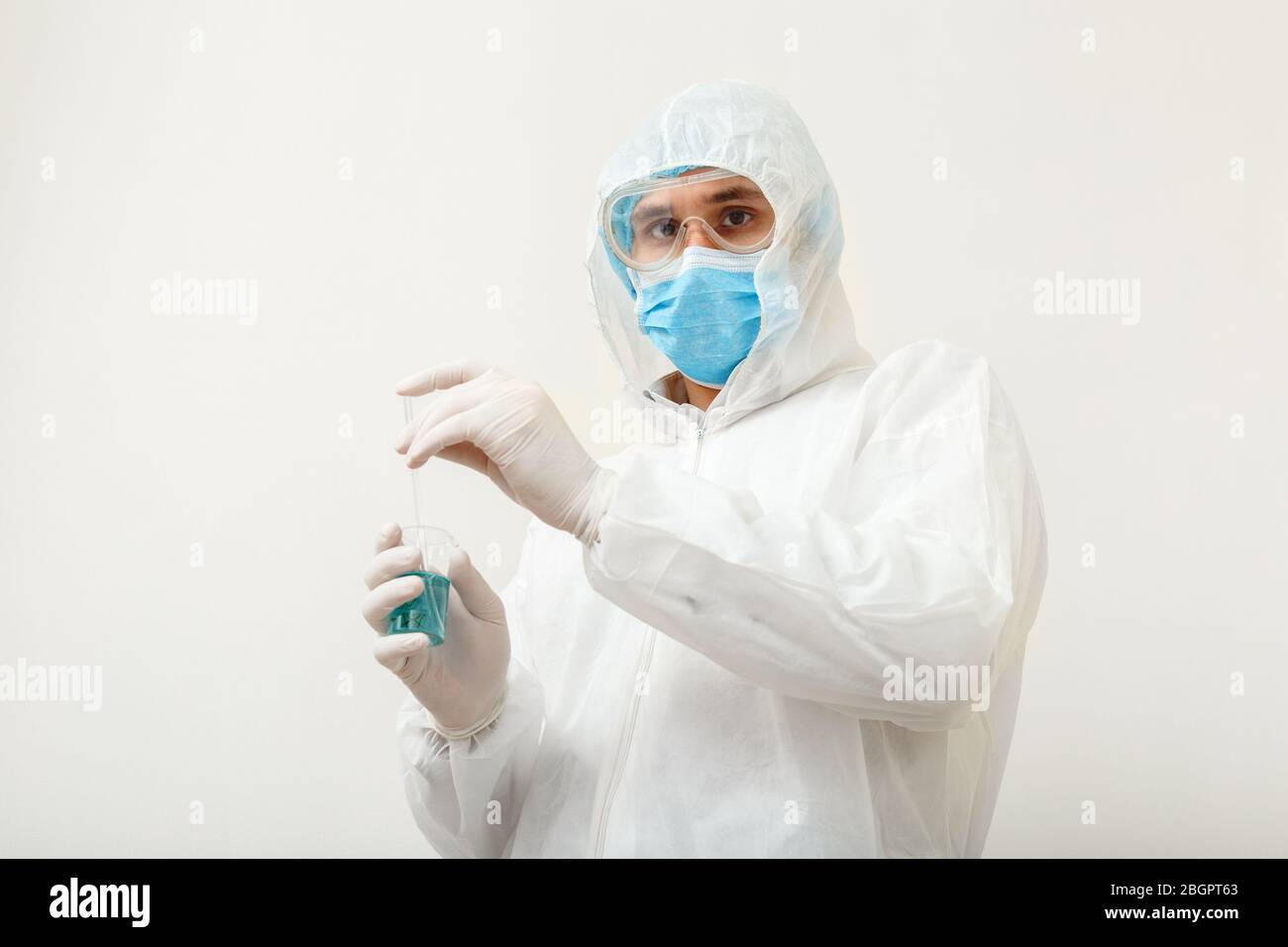 Covid-19 vaccine. Doctor or scientist in protective medical suit ...