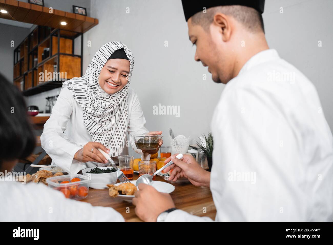 Muslim happy breaking fast hi-res stock photography and images - Alamy