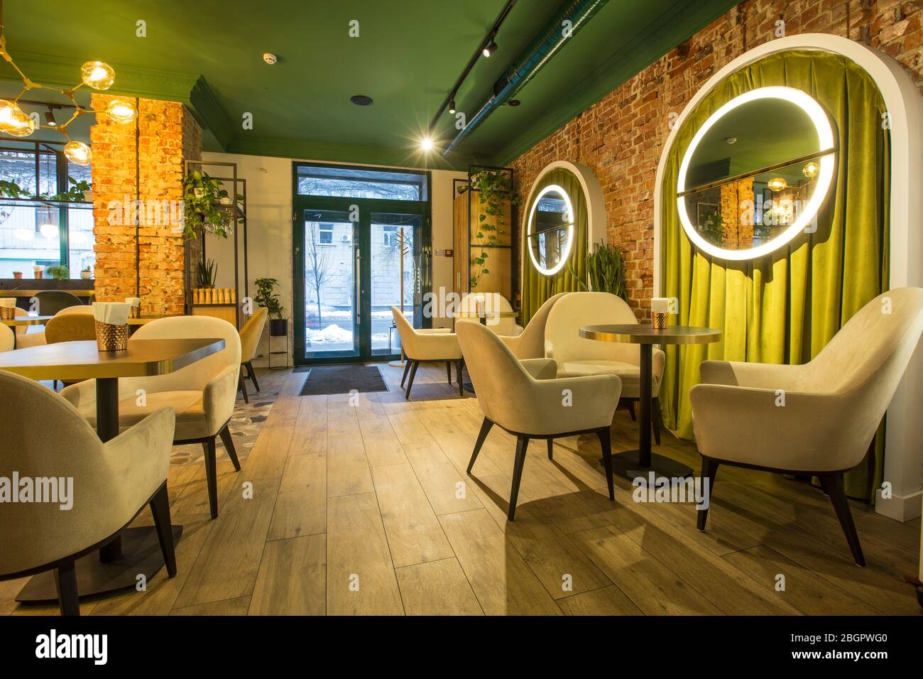 Light modern interior of urban restaurant or cafe with dining places ...