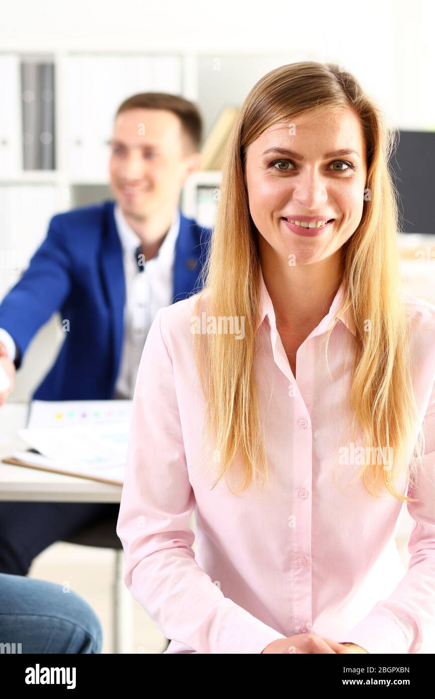 Beautiful smiling cheerful girl at workplace look in camera Stock Photo ...