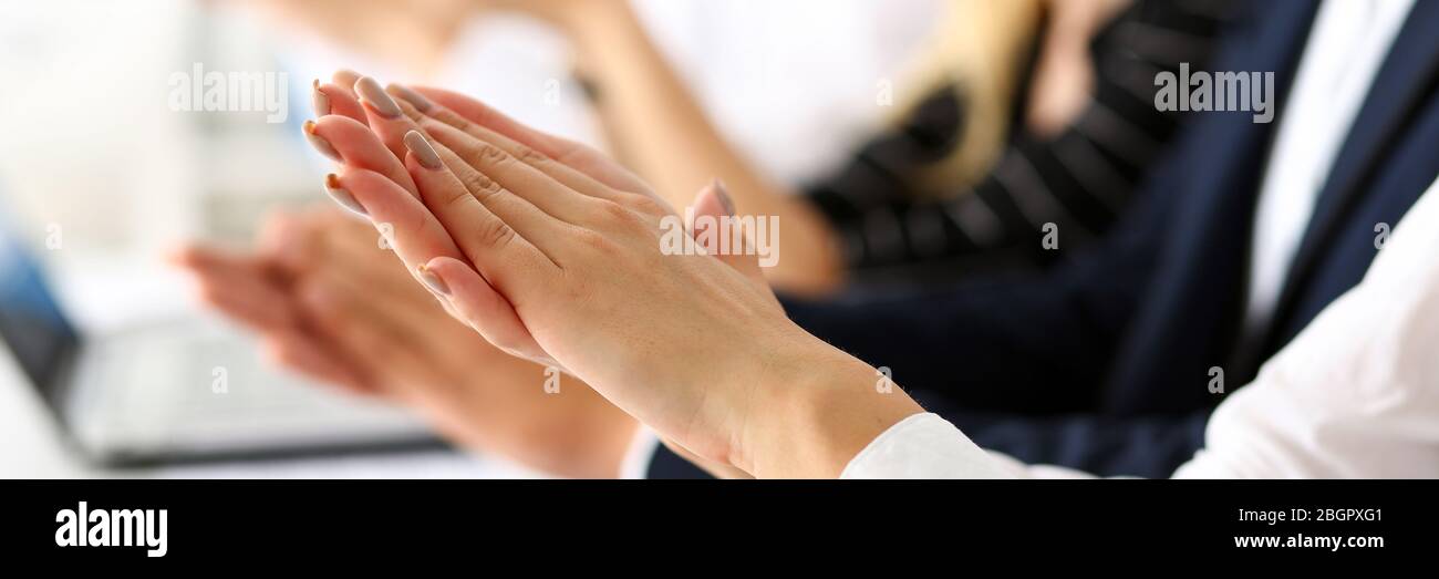 Group of people clap their arm in row Stock Photo - Alamy