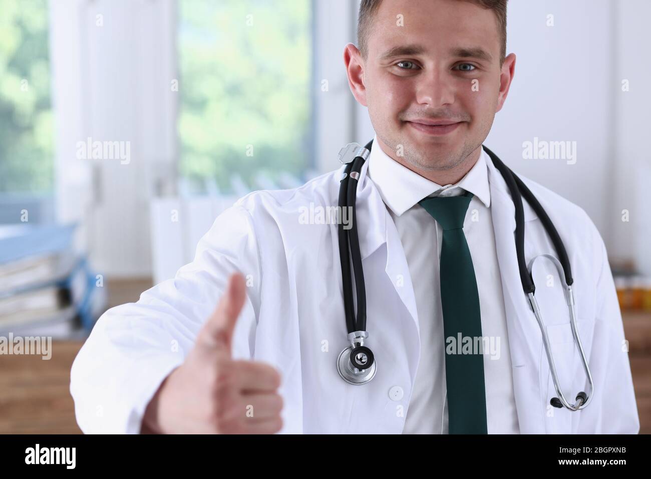 Satisfied happy handsome smiling male patient with doctor Stock Photo ...