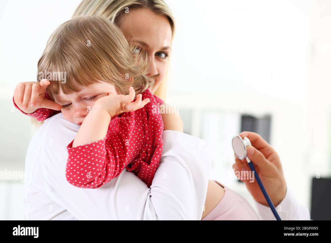 Little child with stethoscope at doctor reception Stock Photo - Alamy