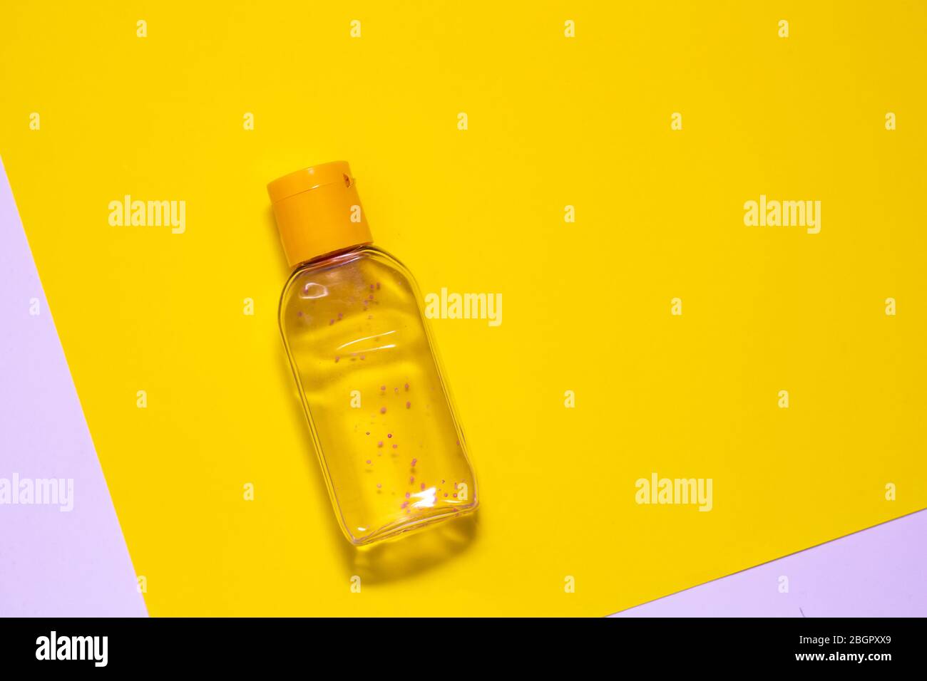 Antiseptic On yellow background, with pink granules Stock Photo - Alamy