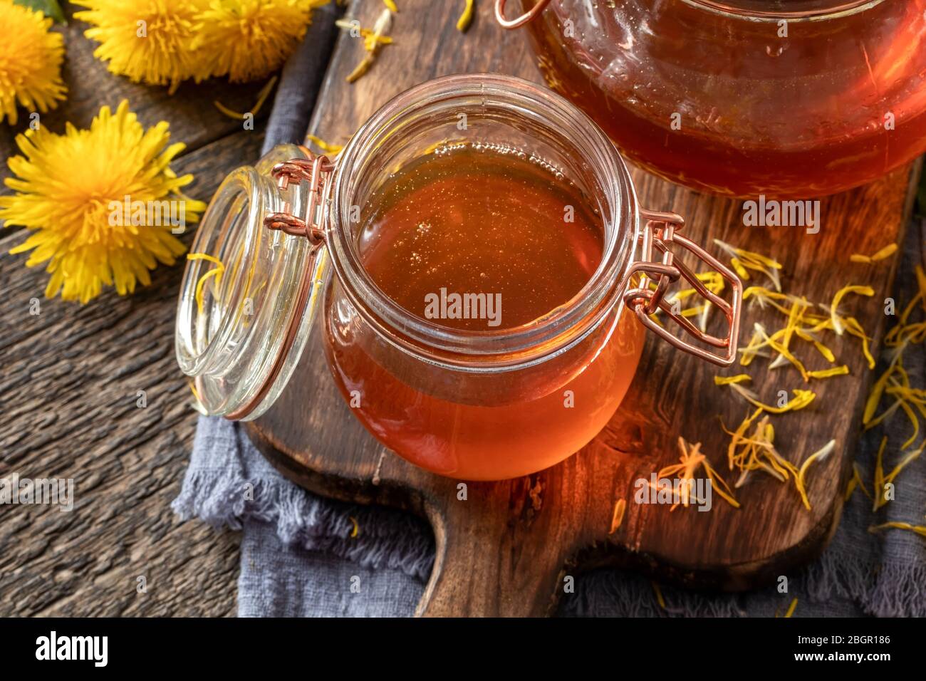Dandelion honey - syrup made from sugar and fresh flowers Stock Photo ...