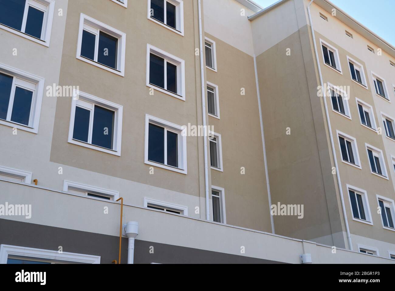 facade of a new multi-storey building with many windows Stock Photo - Alamy