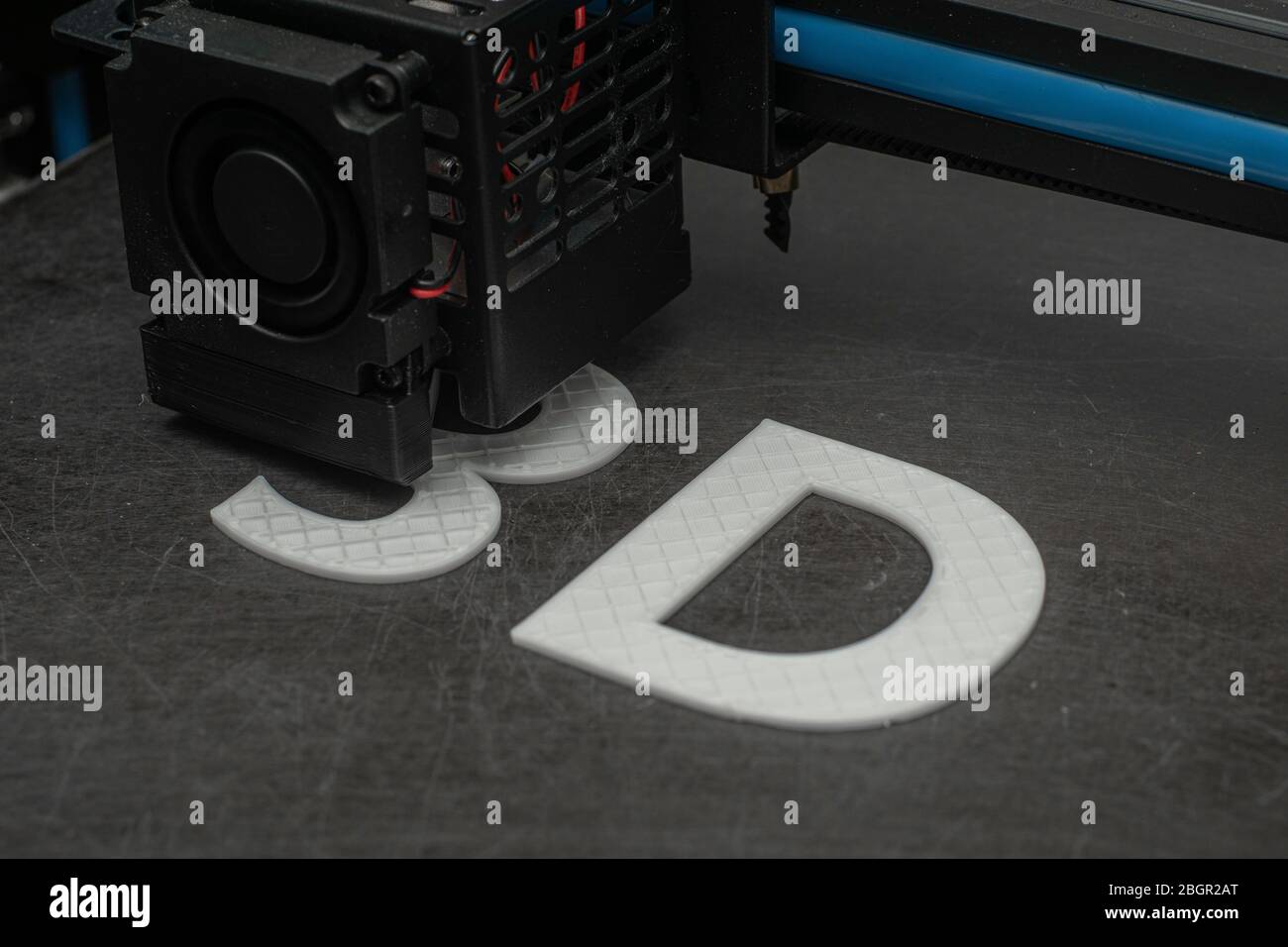 3D printer prints the word 3D with white filament PLA Stock Photo - Alamy