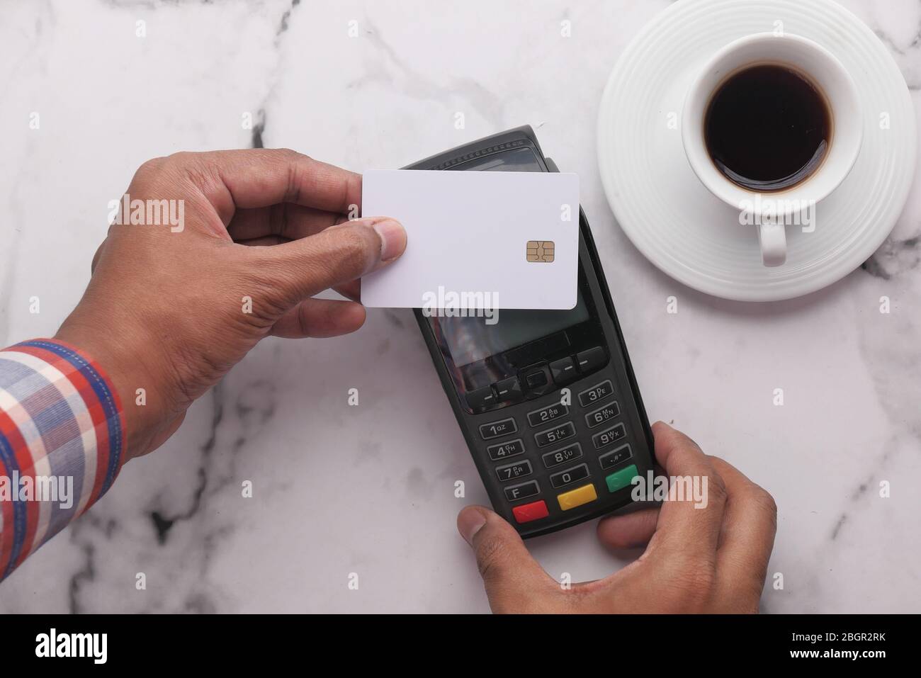 Payment terminal charging from a card, contactless payment Stock Photo ...