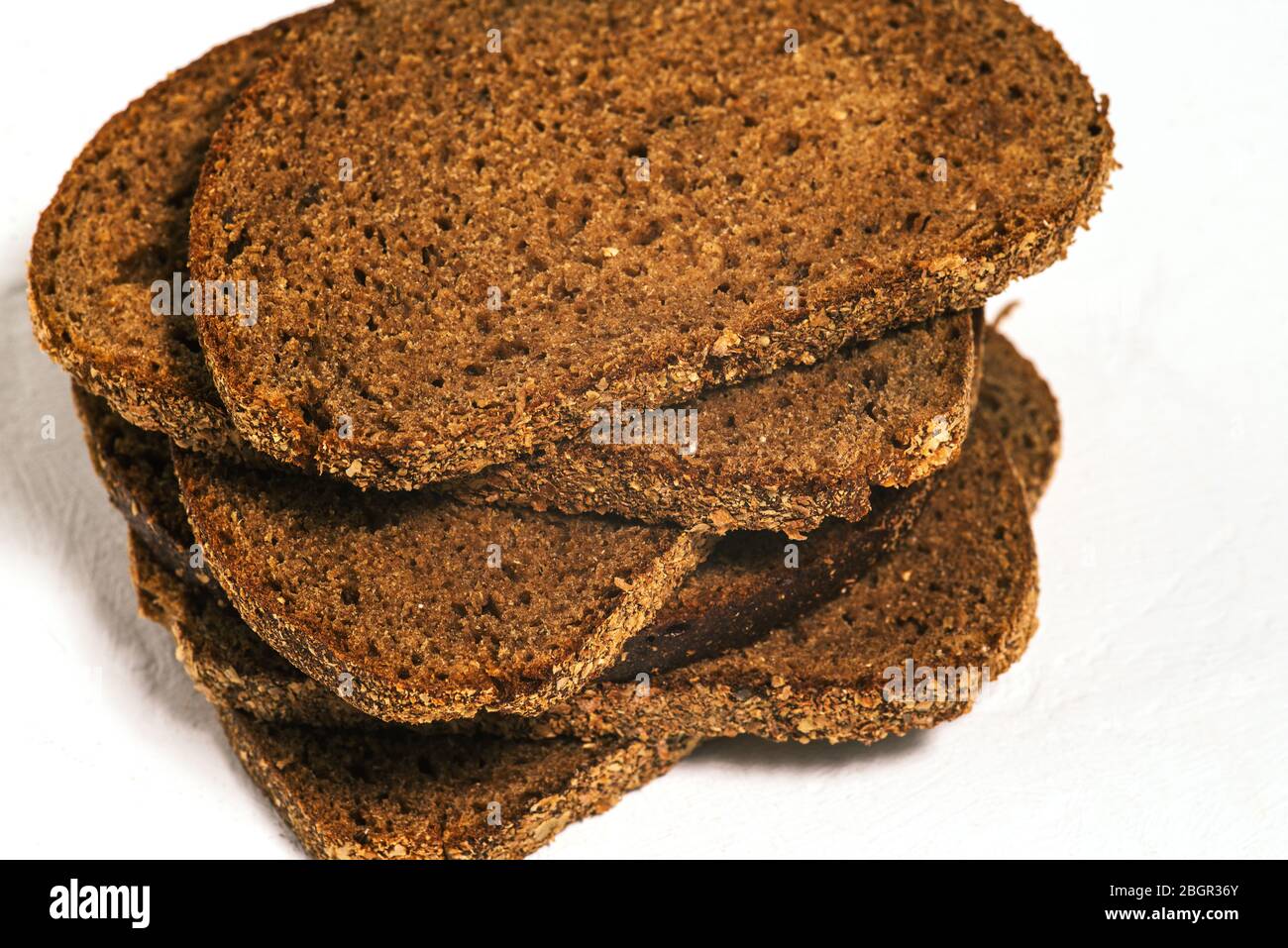 Uncut bread. Delicious rye bread isolated on a white background Stock ...