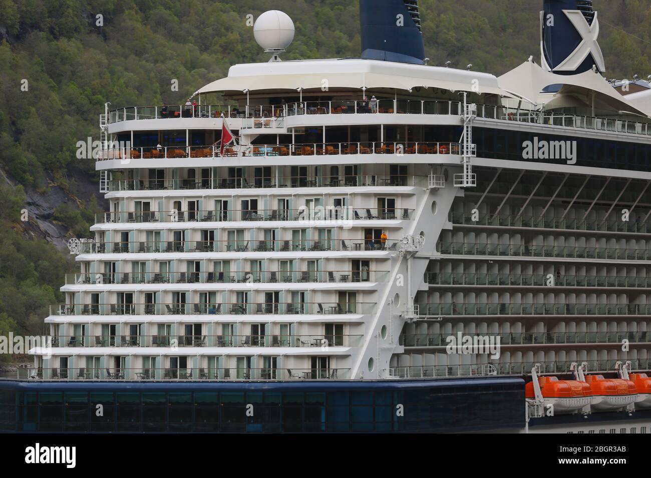 Rear view of cruise liner with passengers and cabins Stock Photo - Alamy