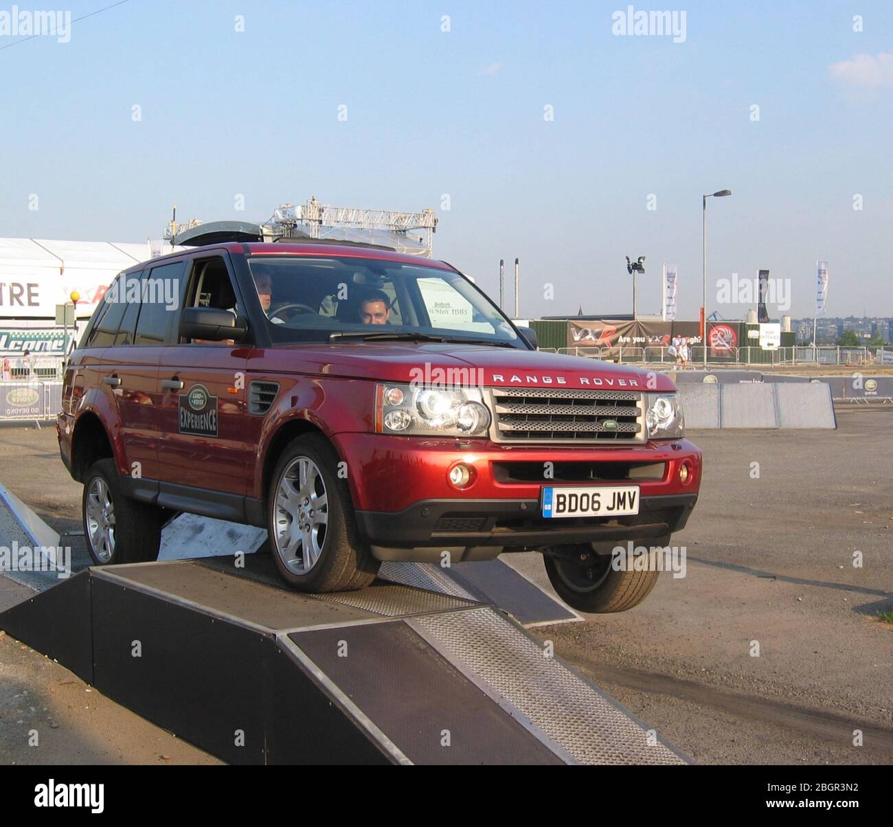 London Car Show red Range Rover car being tested on four wheel drive ...