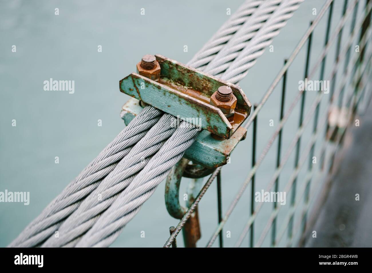 The connection of a large metal cable with a clip for the tether. The ...