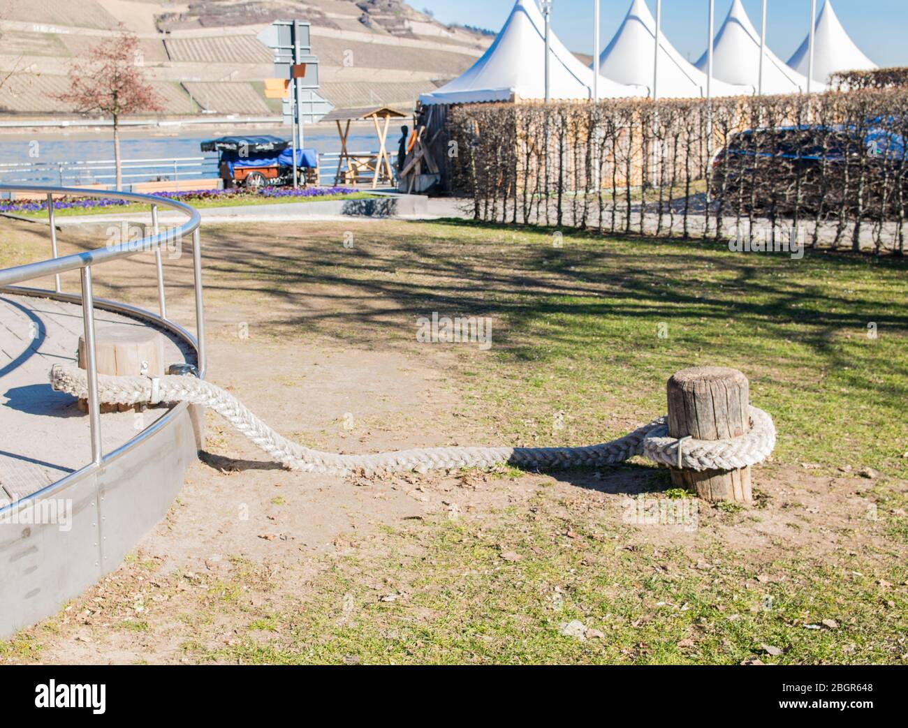 Rope for secure the boat at the harbor in the sunny summer day. Docking ...