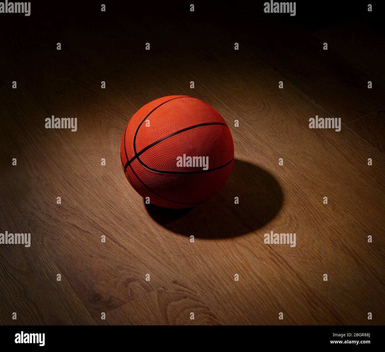 Basketball ball on floor Stock Photo - Alamy
