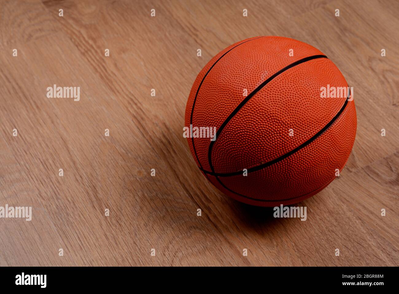 Basketball ball on floor Stock Photo - Alamy