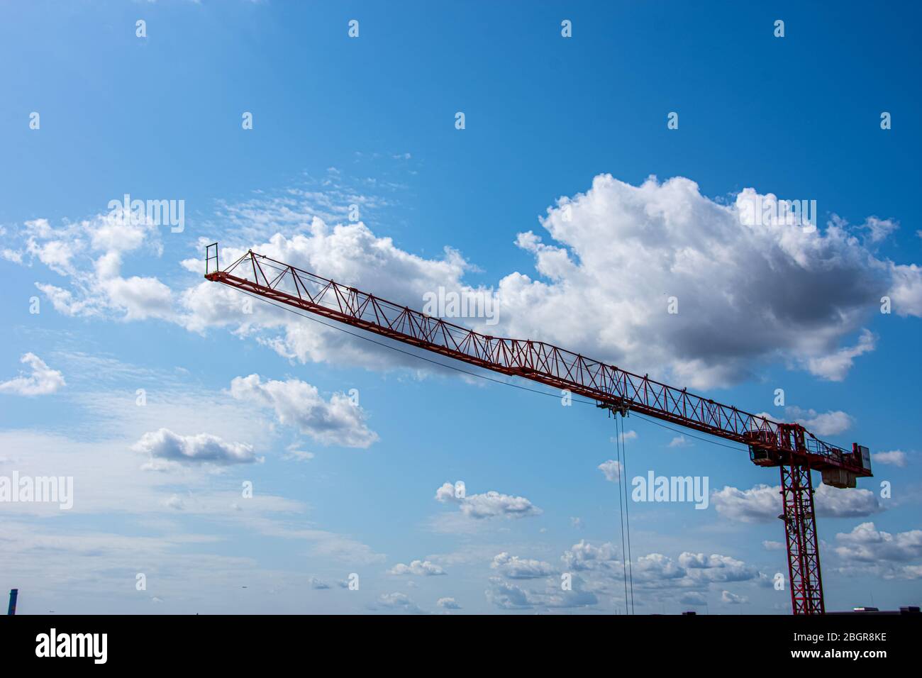 Red crane working create hi-res stock photography and images - Alamy