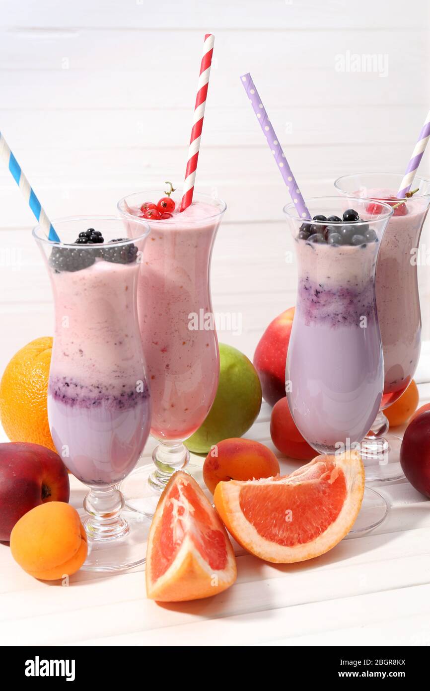Delicious milkshakes on table, close-up Stock Photo - Alamy