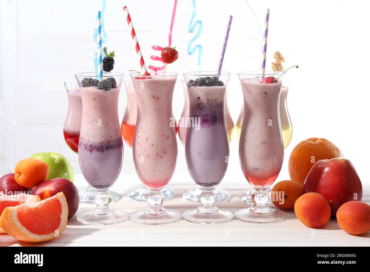 Delicious milkshakes on table, close-up Stock Photo - Alamy