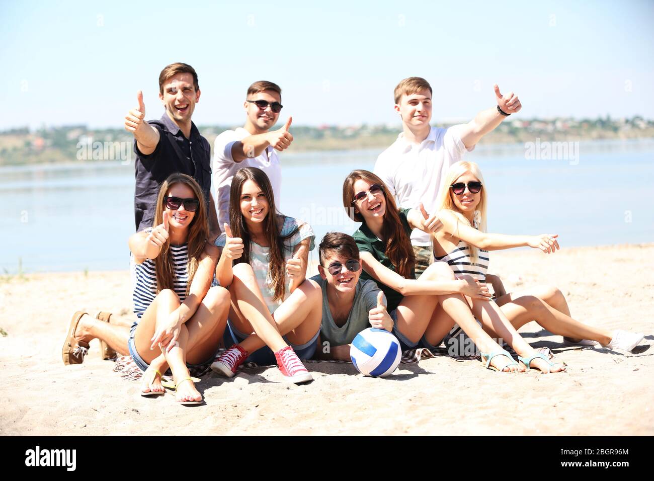 Happy attractive couple beach ball hi-res stock photography and images ...