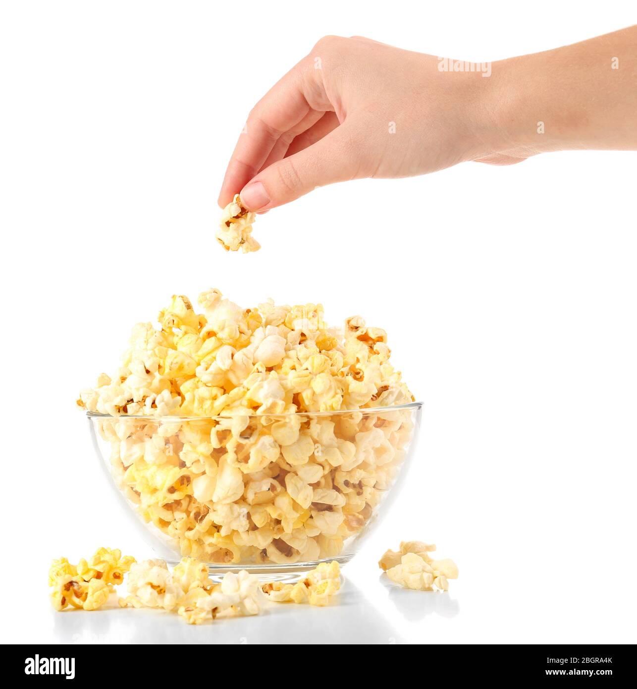 Popcorn in glass bowl isolated on white Stock Photo - Alamy