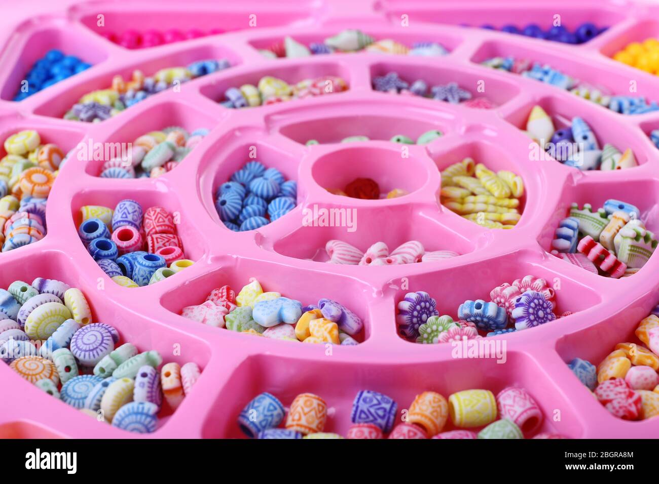 Multicoloured beading kit for children in a pink box Stock Photo - Alamy