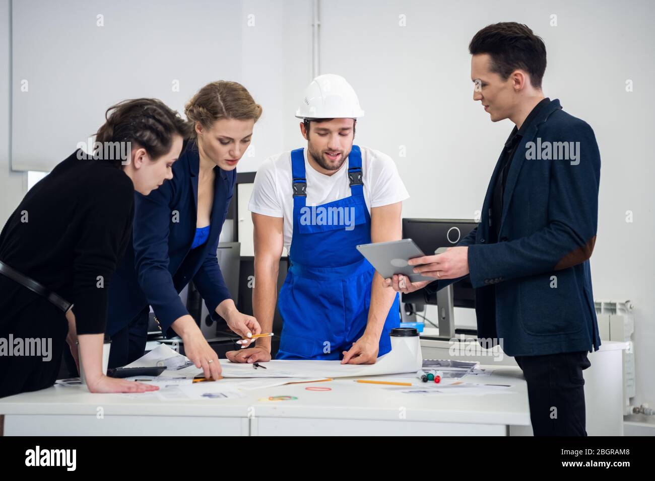 A Construction Design Team Brainstorming in the meeting room, surching ...
