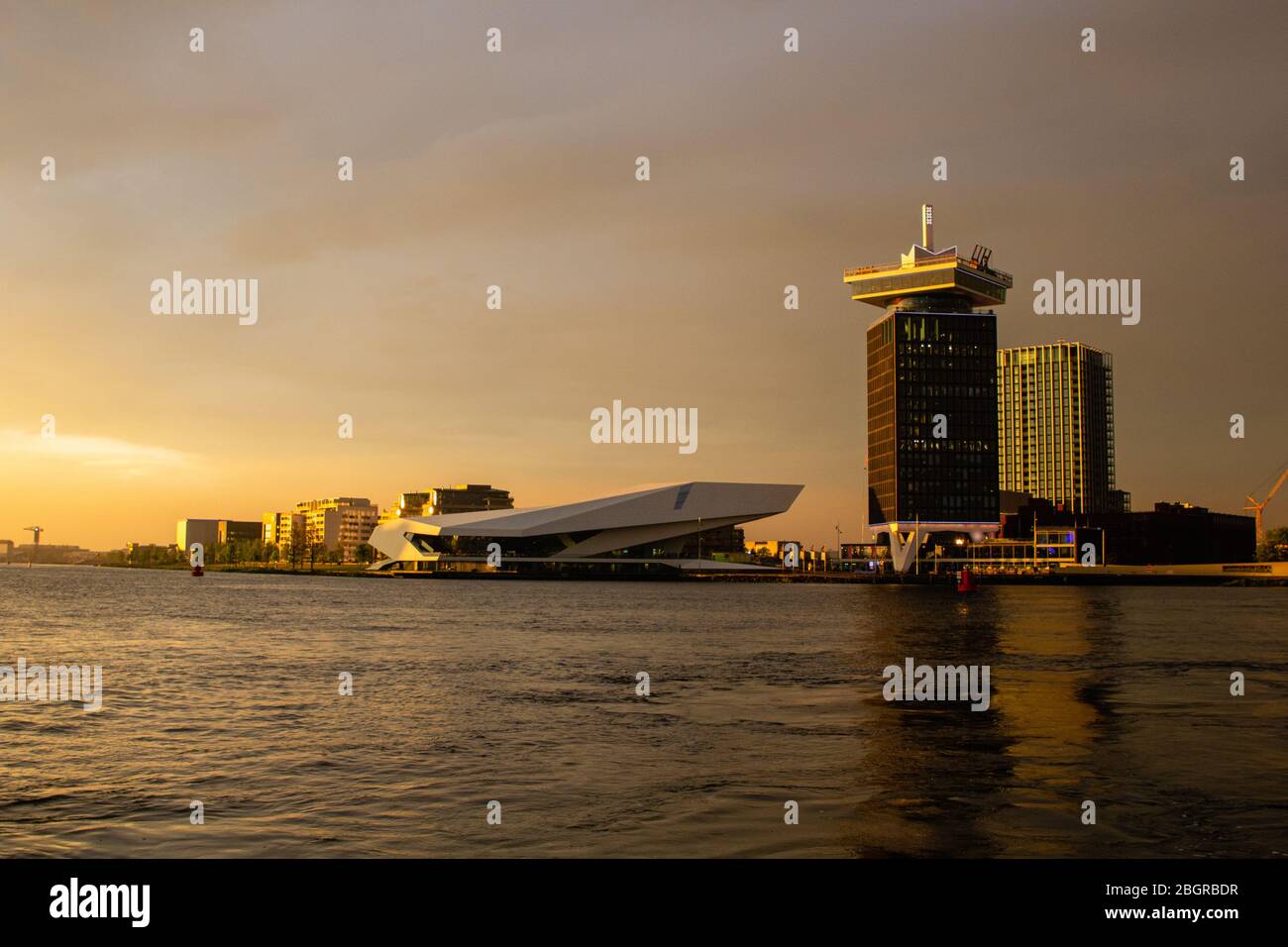 Spring sunset rain near Eye Film Museum in Amsterdam, iconic modern ...