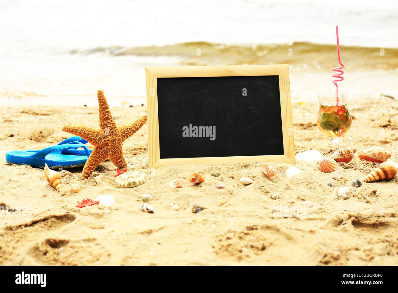 Blank chalkboard on beach background Stock Photo - Alamy