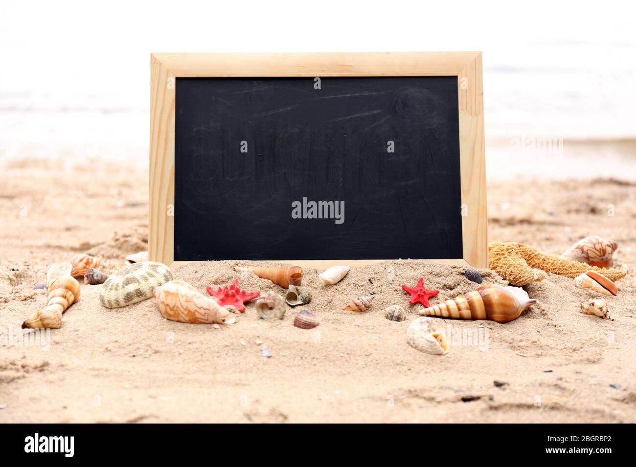 Blank chalkboard on beach background Stock Photo - Alamy
