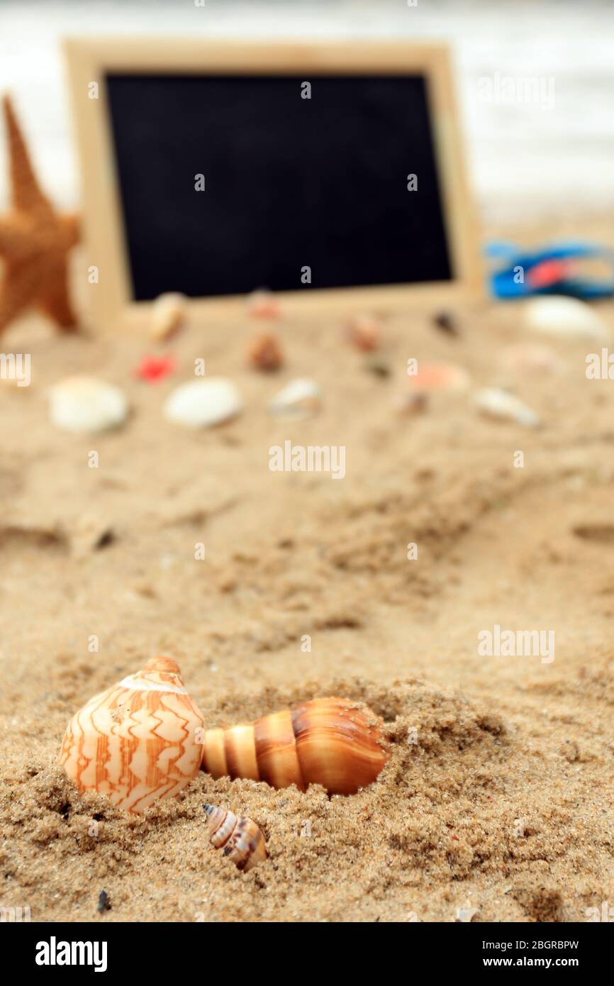 Blank chalkboard on beach background Stock Photo - Alamy