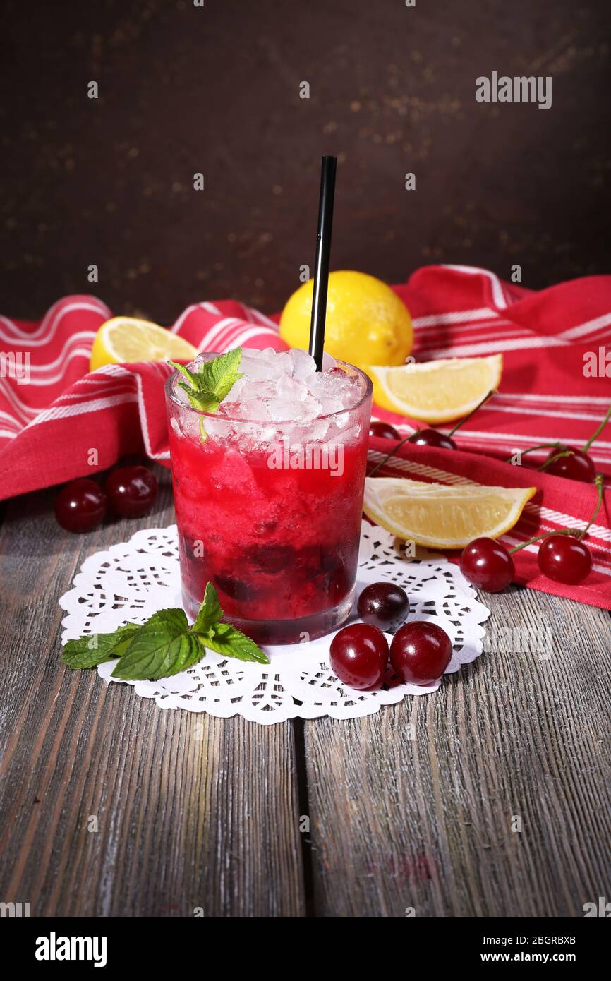 Fresh cold cherry cocktail with mint, ice and lemon Stock Photo - Alamy
