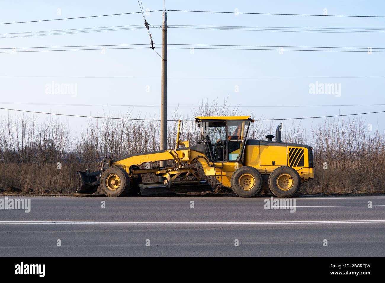 Grader is working on road construction. Grader industrial machine on ...