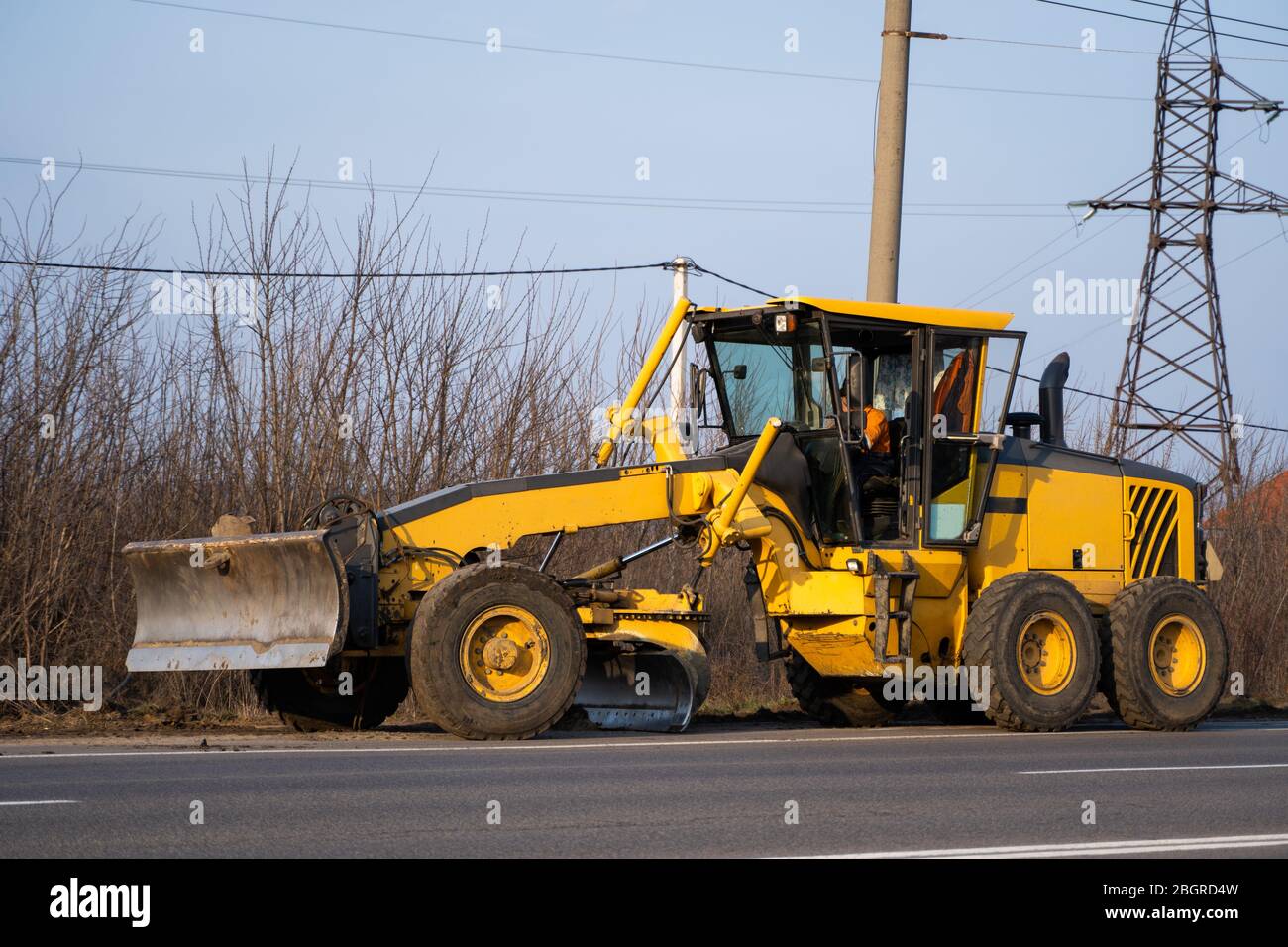 Grader is working on road construction. Grader industrial machine on ...