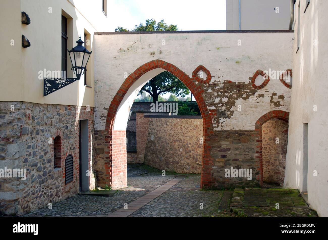 old town way with walls and heritage buildings Magdeburg, Germany Stock ...