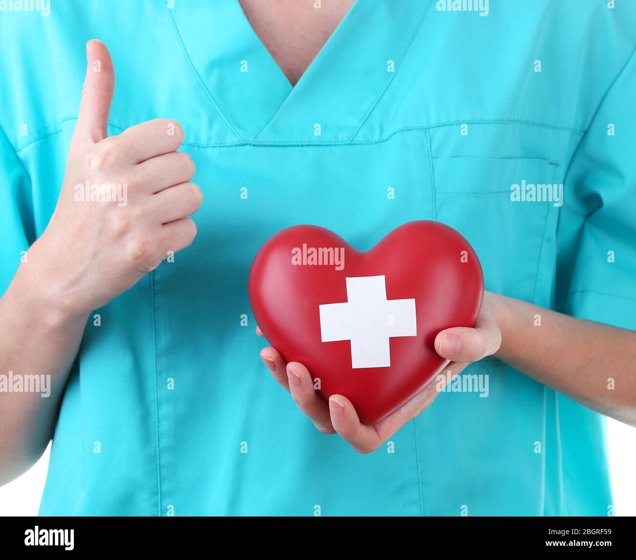 Red heart with cross sign in doctor hand, close-up, isolated on white ...