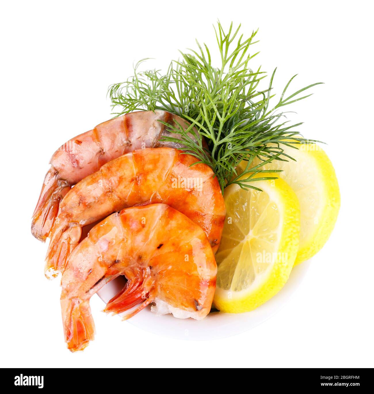 Fresh boiled prawns with dill and lemon in a blue round bowl on white ...