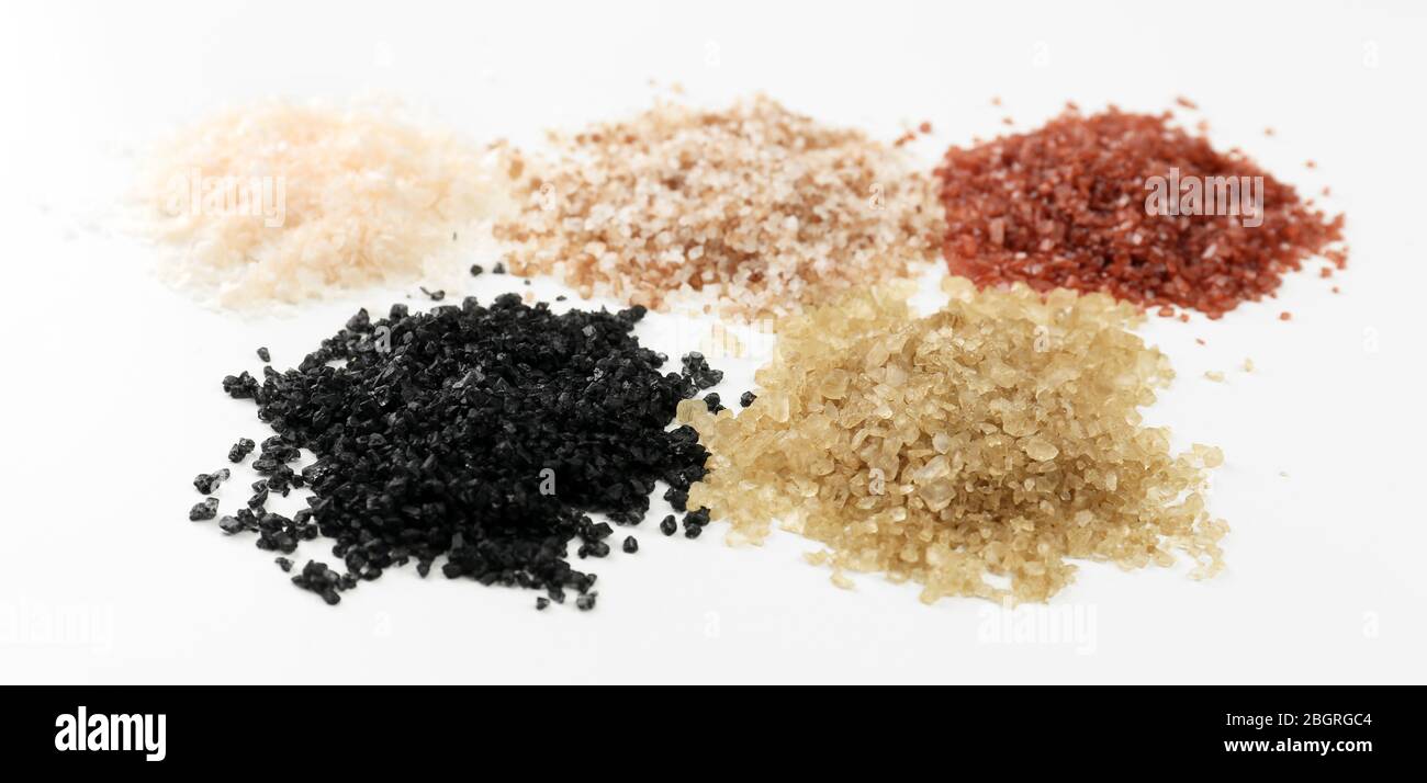 Variety of different sea salt, isolated on white Stock Photo - Alamy