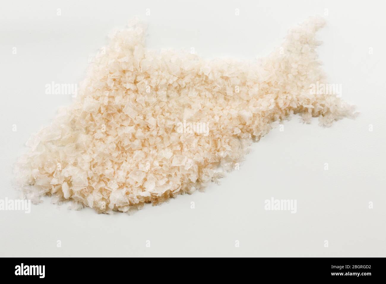 Crystals of sea salt in shape of fish, isolated on white Stock Photo ...