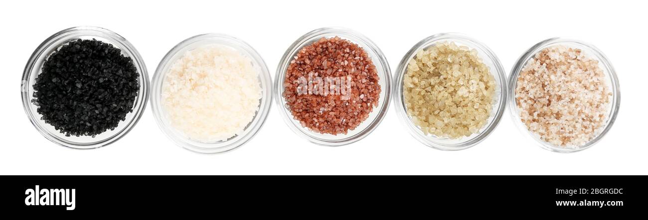 Different sea salt in bowls isolated on white Stock Photo - Alamy