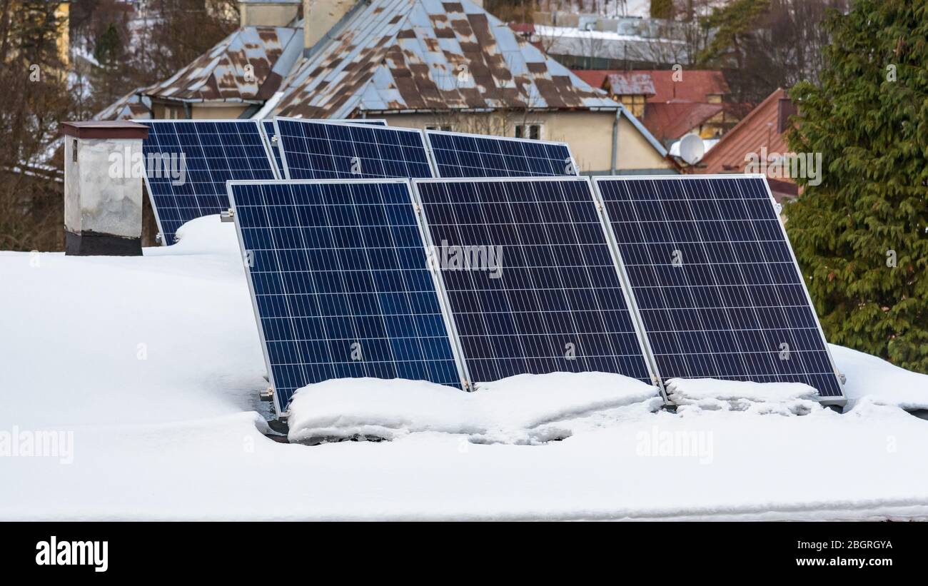Solar panels of photovoltaic power plant on the snow covered roof Stock ...