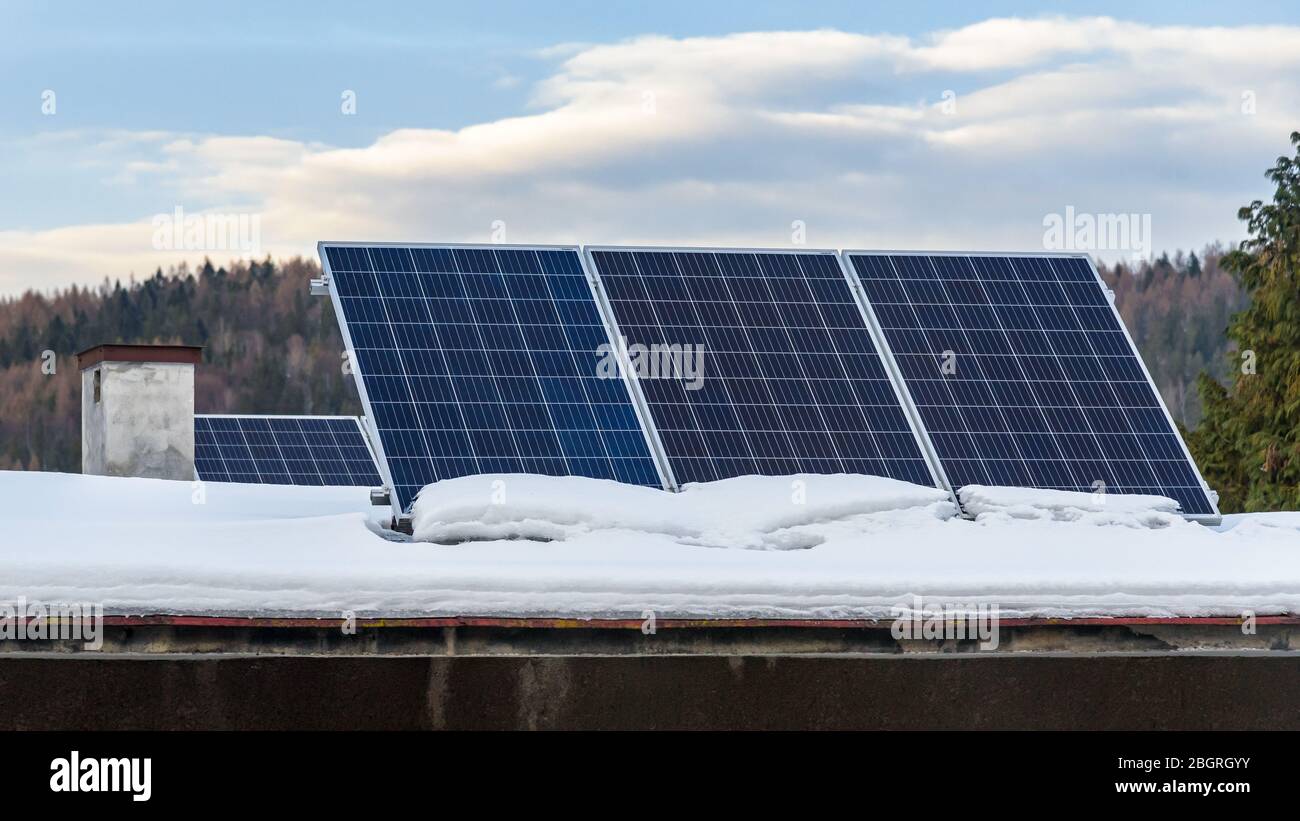 Solar panels covered with snow hi-res stock photography and images - Alamy
