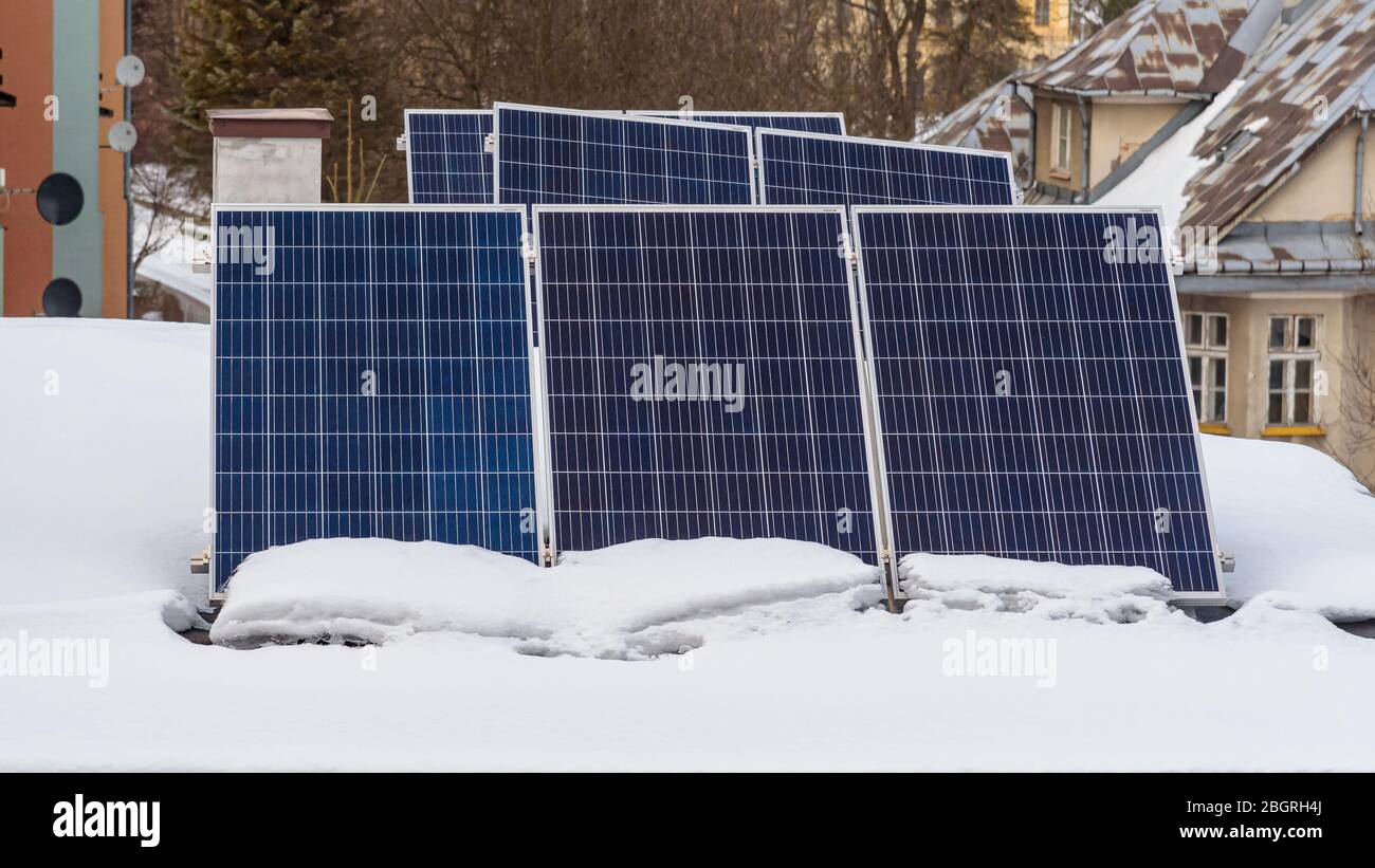 Solar panels of photovoltaic power plant on the snow covered roof Stock ...