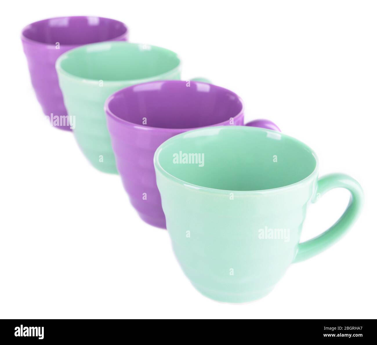 Bright cups isolated on white Stock Photo - Alamy