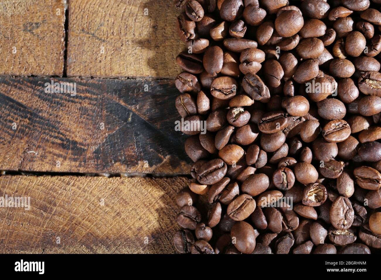Coffee beans on rustic wooden background Stock Photo - Alamy