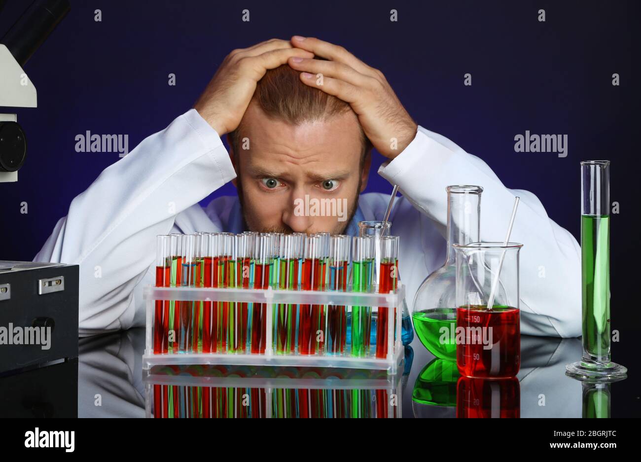 Scientist boy working microscope hi-res stock photography and images - Alamy