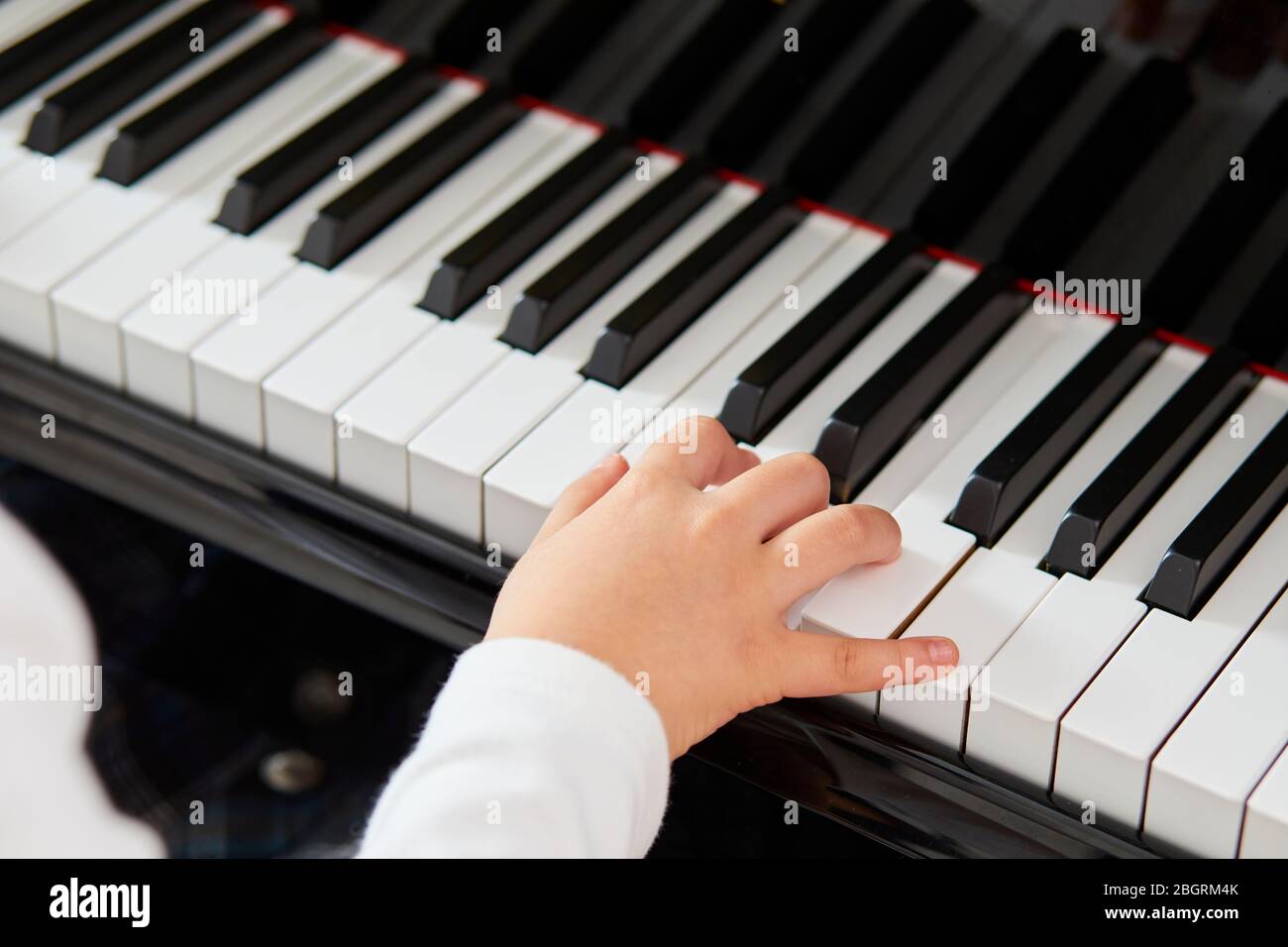 Japanese kid practicing piano Stock Photo - Alamy
