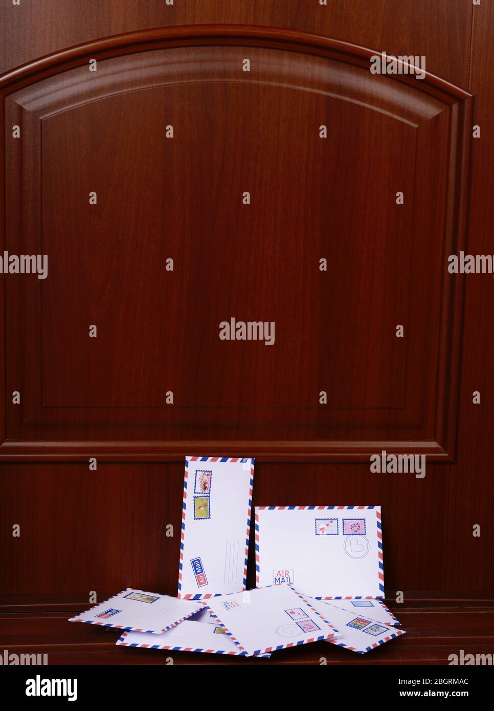 Letters on floor at front door Stock Photo - Alamy