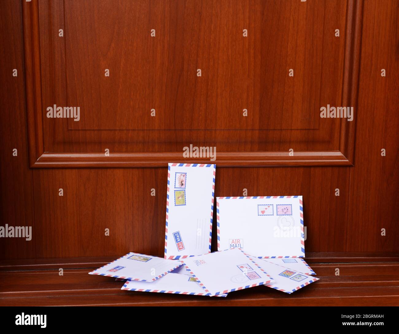 Letters on floor at front door Stock Photo - Alamy