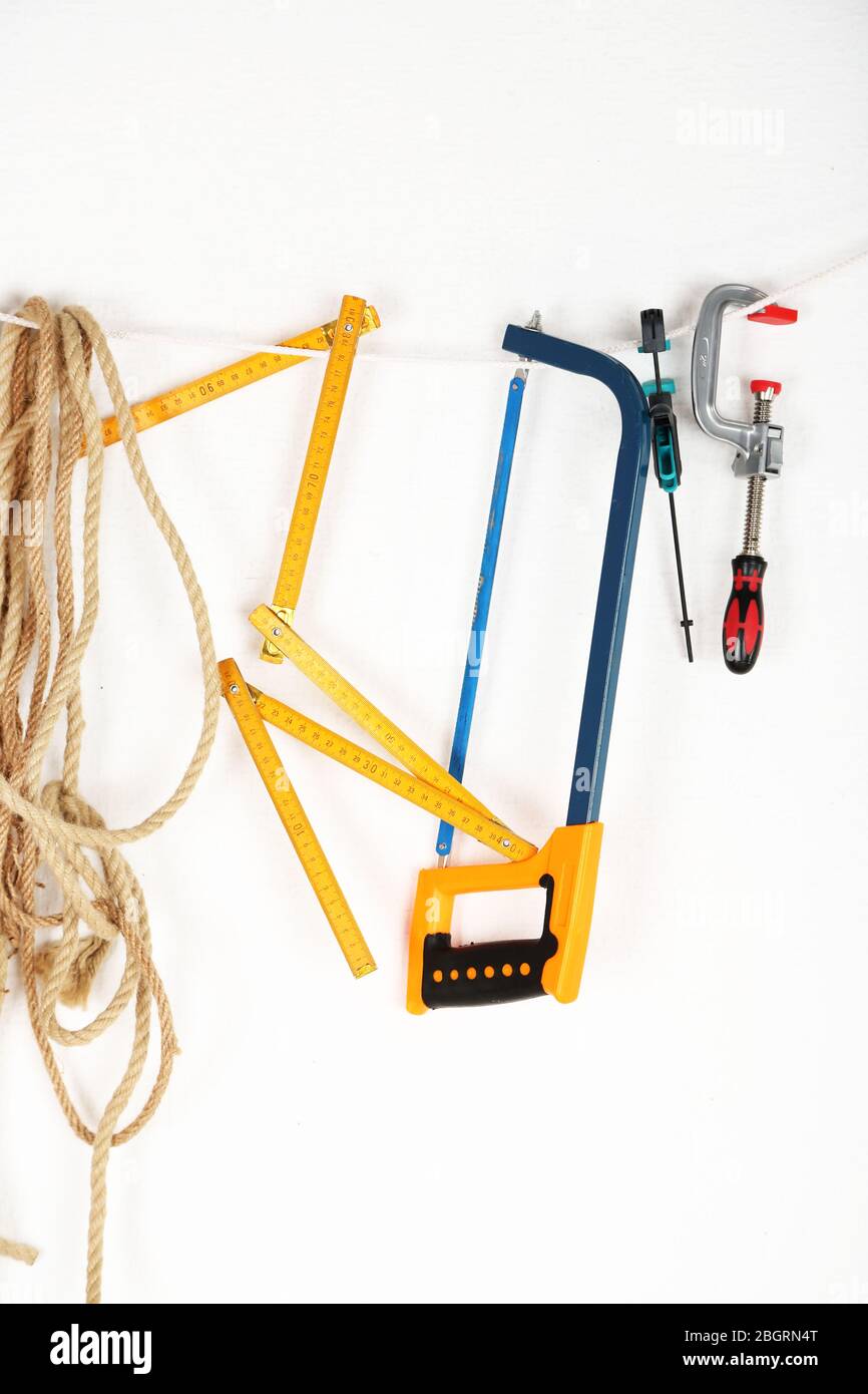 Working tools on wall background Stock Photo - Alamy