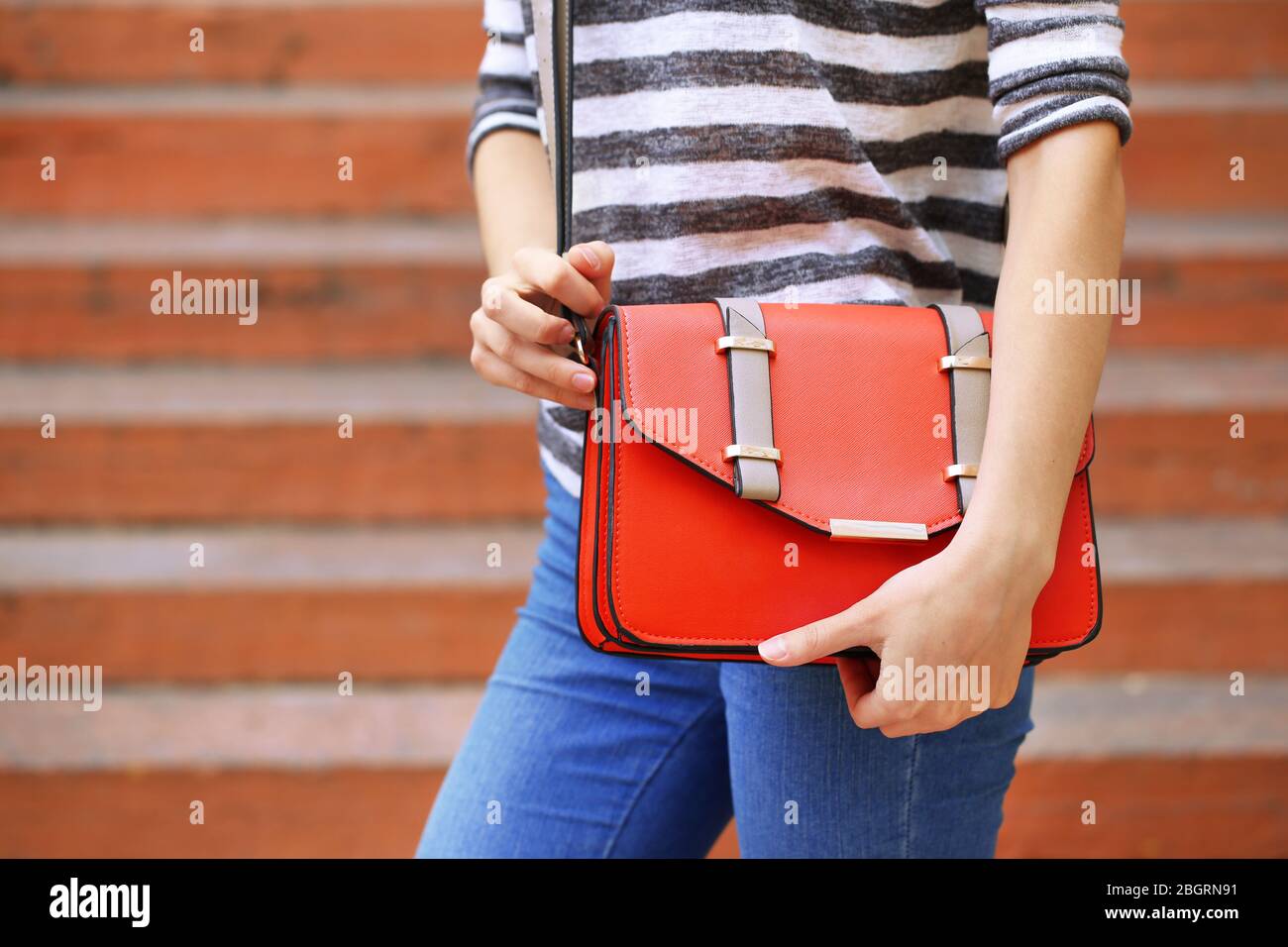 Girl with bag over his shoulder outdoors Stock Photo - Alamy